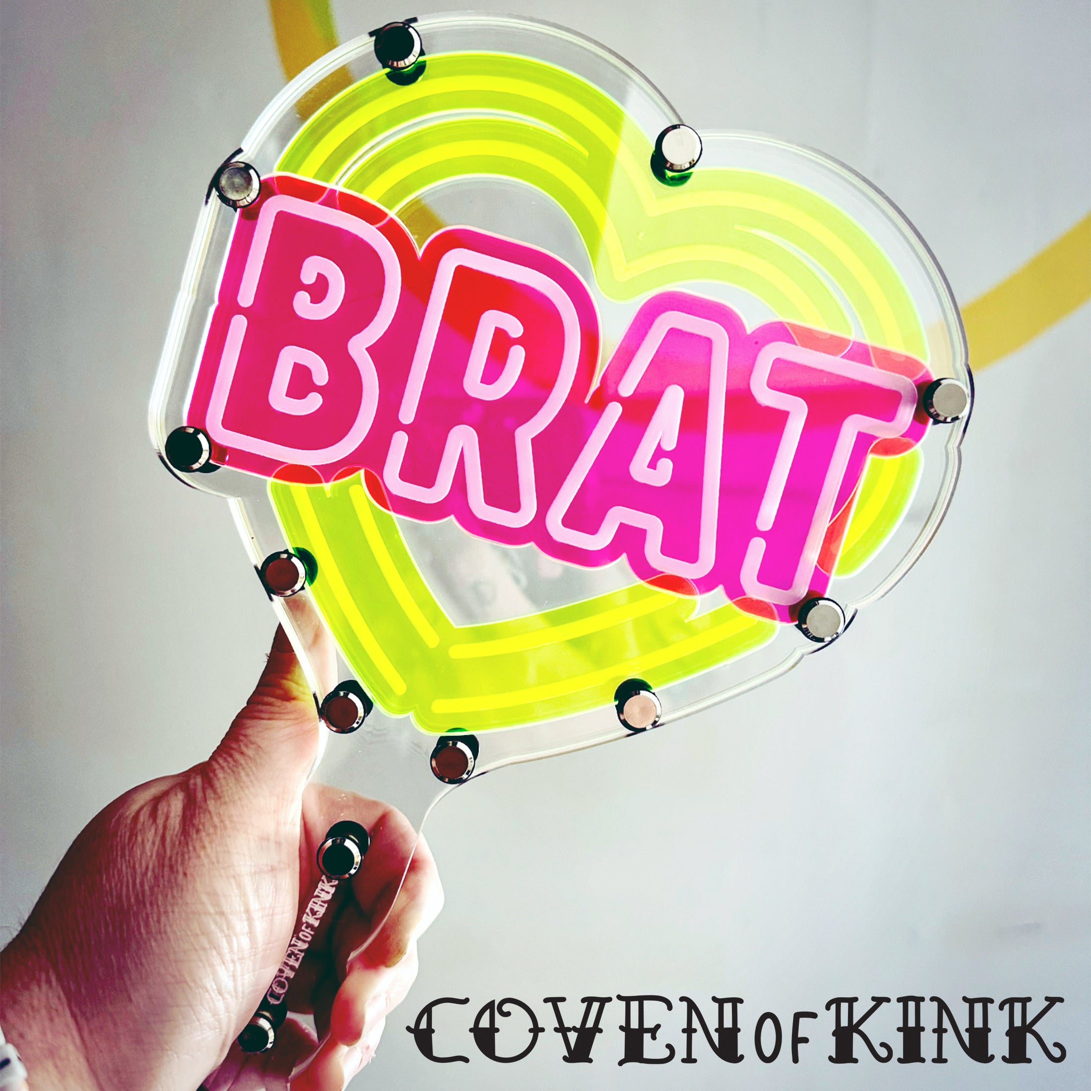 Neon "Brat" Acrylic Paddle: Neon Fun for the Ultimate Brat – Coven of Kink